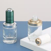 China 30-50ml Round Clear Dropper Glass Skin Care Oil Bottle with White Push Dropper Assembled Dropper for sale