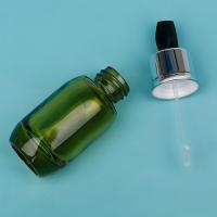 China Skin Care Serum Cream Bottles 15ml 30ml 50ml Clear Green Glass Designs with Stirring Stick Customizable for sale