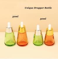 China Industrial Cosmetic Elegant 30ml 50ml 1oz 2oz Green Empty Oil Serum Dropper Bottles with Box Customize Unique Cone Shape for sale
