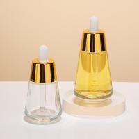 China Industrial Cosmetic Elegant 30ml 50ml 1oz 2oz Green Empty Oil Serum Dropper Bottles with Box Customize Unique Cone Shape for sale