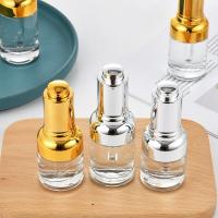 China Round Glass Bottle Alu Dropper Essential Oil Bottle with Box Customize Luxury Oil Push Button Flat Shoulder 20ml 30ml 50ml for sale