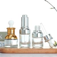 China Round Glass Bottle Alu Dropper Essential Oil Bottle with Box Customize Luxury Oil Push Button Flat Shoulder 20ml 30ml 50ml for sale