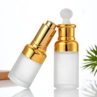 China Round Glass Bottle Alu Dropper Essential Oil Bottle with Box Customize Luxury Oil Push Button Flat Shoulder 20ml 30ml 50ml for sale