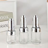 China Round Glass Bottle Alu Dropper Essential Oil Bottle with Box Customize Luxury Oil Push Button Flat Shoulder 20ml 30ml 50ml for sale