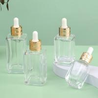 China 15ml 30ml 50ml Unique Green Square Glass Bottle Cosmetic Oil Glass Dropper Bottles Sealing Type Dropper Industrial Cosmetic for sale