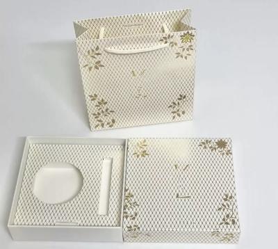 China Custom Logo Soft Touch Finish Hardcover Cardboard Cosmetic Lipstick Lip Gloss Packing Magnetic Gift Box Set With Paper Rigid Box for sale