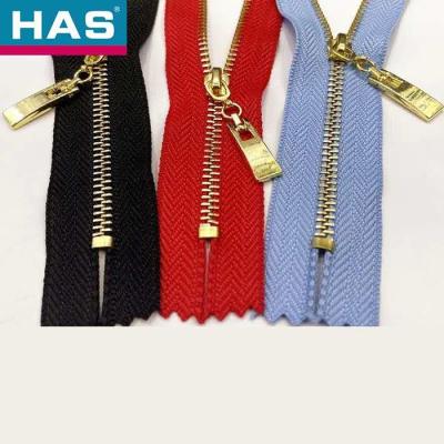 China Light Gold Teeth Zipper With Auto-Lock Hook Slider Teeth Close End Zippers for sale