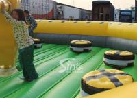 China Customized challenge outdoor inflatable meltdown game with rotative machine for kids for sale