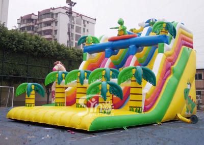 China Giant Double Lane Dragon Inflatable Forest Slide 0.55mm PVC Tarpaulin with Palm Trees for sale