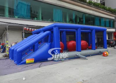 China Outdoor double lane adults interactive inflatable assault course with big bouncing balls for sale
