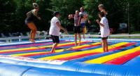 China Giant Inflatable Jump Pad 15x9m Heavy Duty PVC Bounce Mat for Kids Adults Outdoor Party Fun for sale