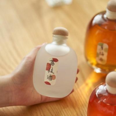 China Empty Glass Bottle Matte Frosted Clear Glass Bottles With Cork for sale