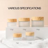 China Long Service Life Frosted Glass Cosmetic Glass Jar With Bamboo Lid for sale