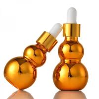 China Gold Gourd Shaped Cosmetics Bottle Professional Empty Glass Bottle For Packaging for sale