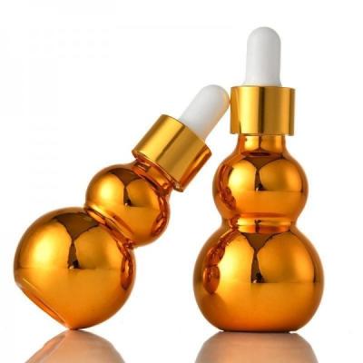 China Gold Gourd Shaped Cosmetics Bottle Professional Empty Glass Bottle For Packaging for sale