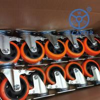 China 4 Inch Hollow Core Polyurethane Wheels Orange Black Wheel Swivel Locking Casters for sale