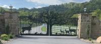 China Home Aluminium Folding Gate Sleek Aluminum Exterior Gates Customized for sale