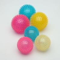 China TPR Spiky Rubber Dog Chew Ball with Cotton Rope 28cm 80g Interactive Bite Toy for sale