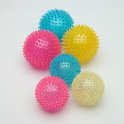 China TPR Spiky Rubber Dog Chew Ball with Cotton Rope 28cm 80g Interactive Bite Toy for sale