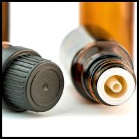 China 10ml Brown Essential Oil Glass Bottles With Anti Theft Black Head Inner Plug for sale