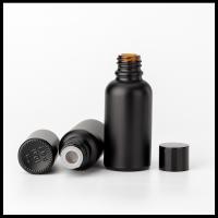 China Black Frosted Color Essential Oil Glass Bottles Cosmetic Packaging Round Shape for sale