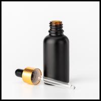China Black Frosted Color Essential Oil Glass Bottles Cosmetic Packaging Round Shape for sale
