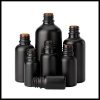 China Black Frosted Color Essential Oil Glass Bottles Cosmetic Packaging Round Shape for sale