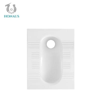 China CUPC Certified S Trap Ceramic Squatting Pan Toilet 580x450x190mm Commercial Sanitary Ware for sale