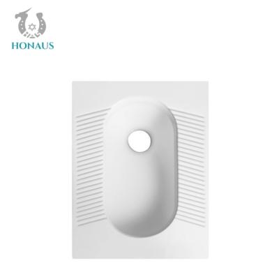 China Economic Porcelain Hotel Squatting Pan Toilet Standard Size 560x415x180mm Fully Glazed for sale
