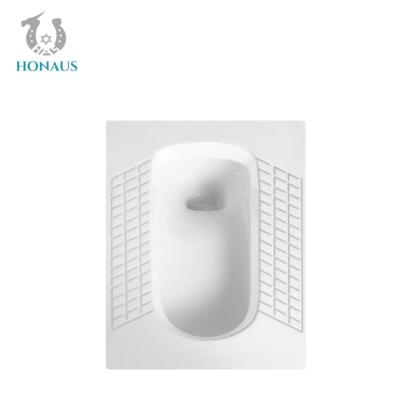 China Ceramic Squatting Pan Toilet 550x430x230mm S-Trap Anti-Slip Foot Pedal White for sale