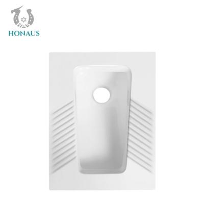 China Ceramic Squat Pan Toilet Anti Odor S Trap 590x465x210mm Commercial Washdown for sale