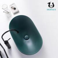 China Matte Black Jade Green Ceramic Countertop Basin 610x360mm Modern Nordic Style Bathroom Sink for sale