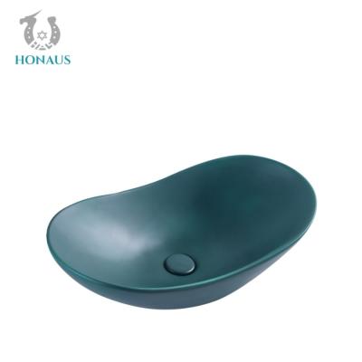 China Matte Black Jade Green Ceramic Countertop Basin 610x360mm Modern Nordic Style Bathroom Sink for sale
