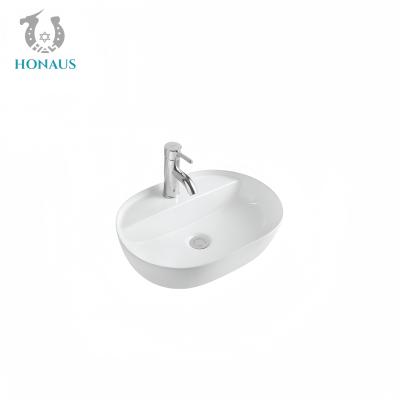 China Oval Bathroom Countertop Basin 1280 Degree Burned Ceramic 600x400x135mm Customizable for sale