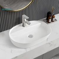 China Oval Bathroom Countertop Basin 1280 Degree Burned Ceramic 600x400x135mm Customizable for sale