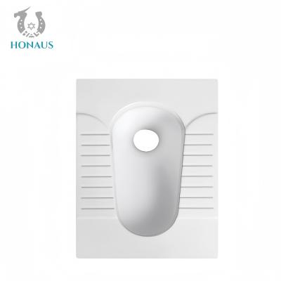 China Ceramic Squatting Pan Toilet 560x425x230mm Anti Scratch Glaze Anti Slip Front Back Flush for sale