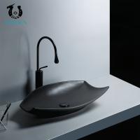 China Luxury Bathroom Countertop Basin High Quality Ceramic Art Design Shape Black for sale