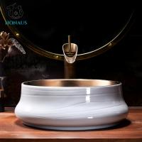 China Bathroom Countertop Basin Exquisite Ceramic Modern Style White Gold Coated Surface for sale