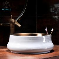China Bathroom Countertop Basin Exquisite Ceramic Modern Style White Gold Coated Surface for sale