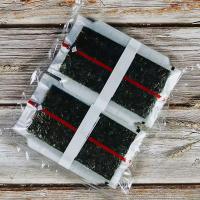China Custom Safe Food Clear Plastic Restaurant Triangle Onigiri Nori Rice Seaweed Nori Sheets for Onigiri for sale