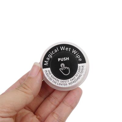 China Environmentally Friendly OEM Portable Push Non-woven Biodegradable Towel Magical Tissue Coin Cleaning Wet Wipes for sale