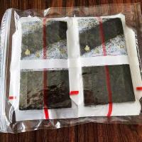 China Custom Safe Food Clear Plastic Restaurant Triangle Onigiri Nori Sheets with 21 cm Length and 24 Months Shelf Life for sale