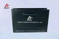 China Special Customized Extra Large Paper Shopping Bags Blue Color Embossed Logo for sale
