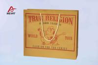 China Customized Kraft Recycled Paper Gift Bags LOGO Printing Yellow Color Foil Surface for sale