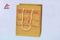 China Customized Kraft Recycled Paper Gift Bags LOGO Printing Yellow Color Foil Surface for sale