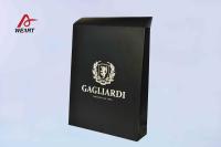 China Special Customized Christmas Paper Gift Bags Blue Color Embossed Logo With Blue Handle for sale