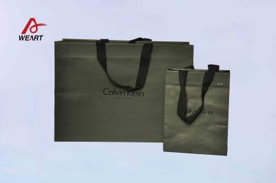 China Special Customized Paper Bags Blue Color Embossed Logo With Blue Handle for sale