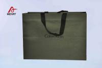 China Special Customized Paper Bags Blue Color Embossed Logo With Blue Handle for sale