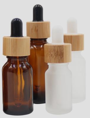 China 30ml Frosted Glass Dropper Bottle with Bamboo Lid Durable Cosmetic Packaging for sale