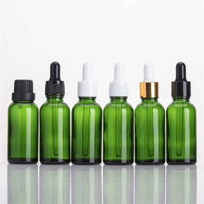 China Green Essential Oil Glass Dropper Bottles 5ml 15ml 100ml Low Borosilicate Glass for sale